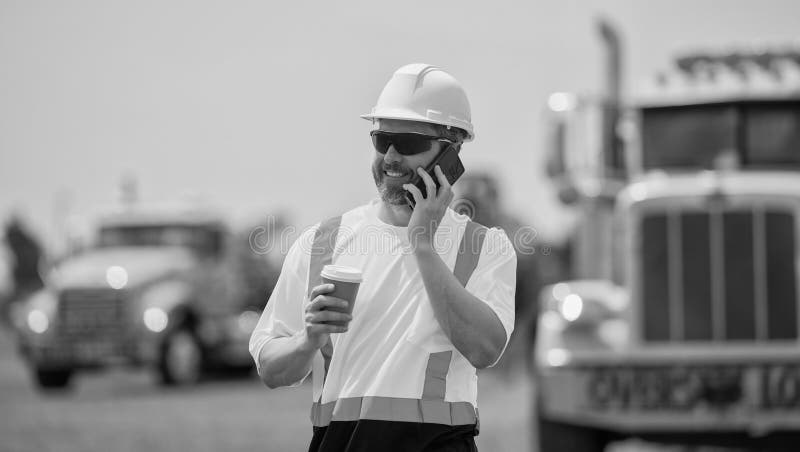 Construction Site Worker Hold Coffee. Mature Architect in Construction ...