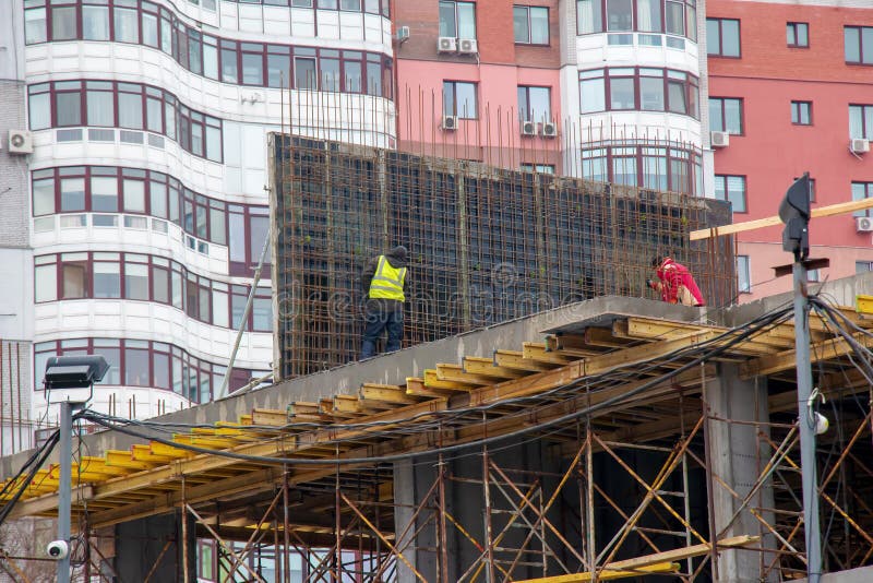 Construction Site. the Worker Performs Work at Height Stock Photo ...