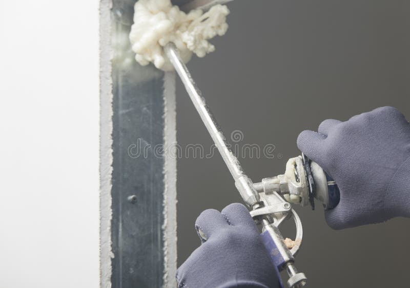 Doorway Fixing with Extending Foam Stock Image - Image of person ...