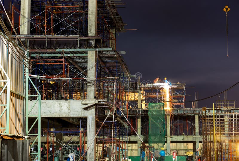Construction Site with Worker Working at Night Stock Image - Image of ...