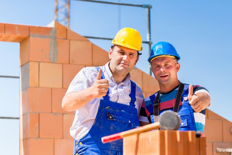 Construction Site Workers Building Walls on House Stock Photo - Image ...