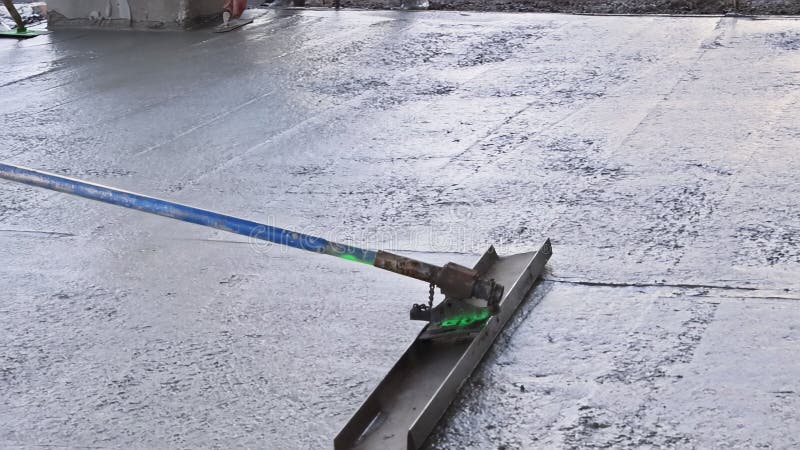 Concrete Leveling Workers on Construction Site with a Mix Trowel ...