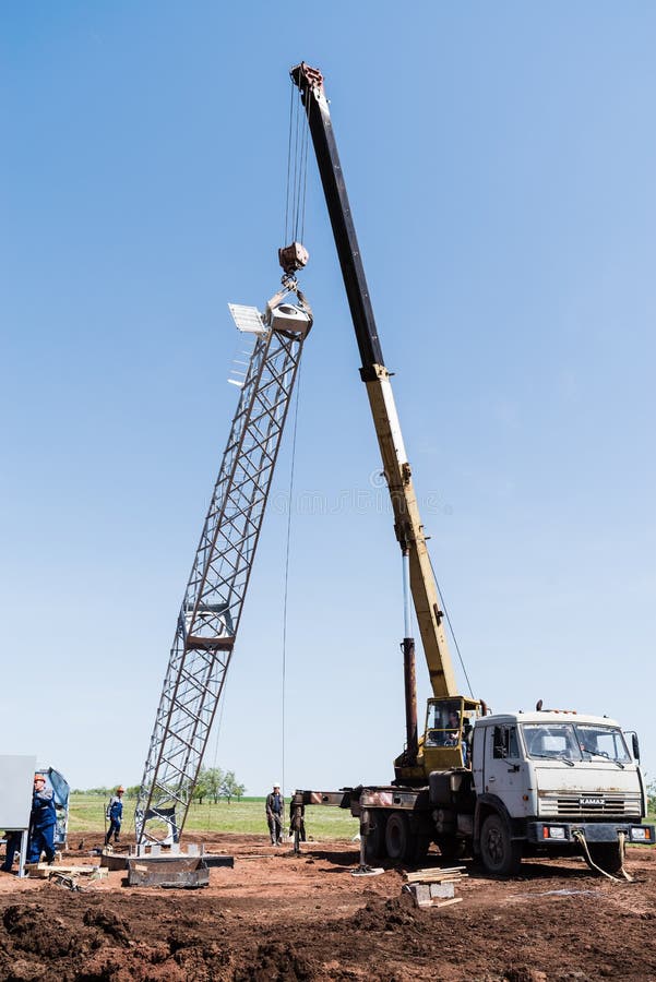 Construction Site, Workers Using Construction Equipment Install a Wind ...