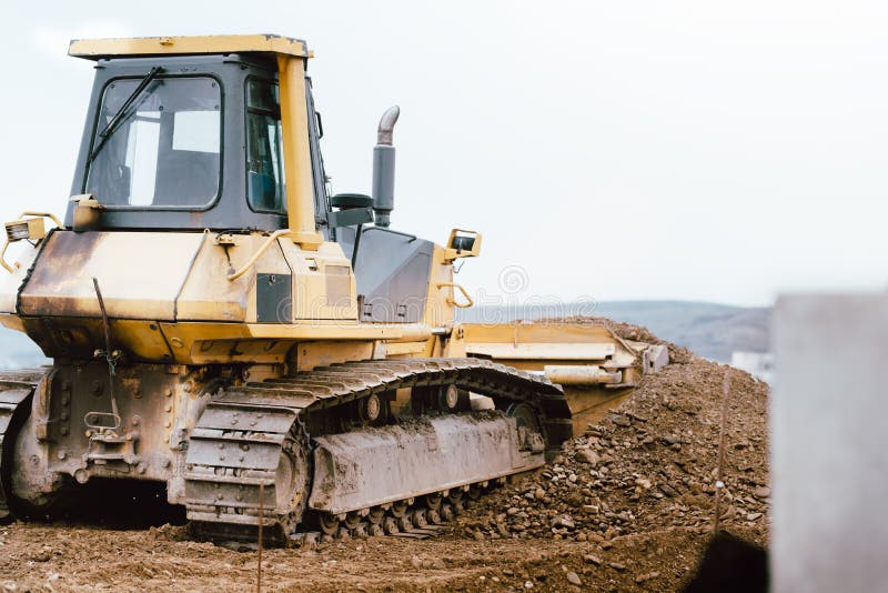 Industrial Construction Site Yellow Bulldozer Levelling and Moving Soil ...