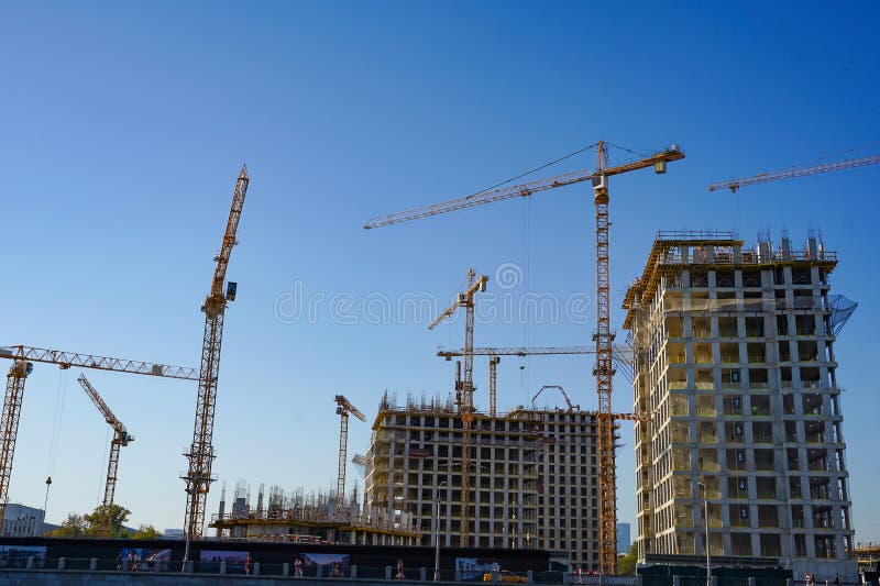 Construction Site with Yellow Tower Cranes and Concrete Structure of ...