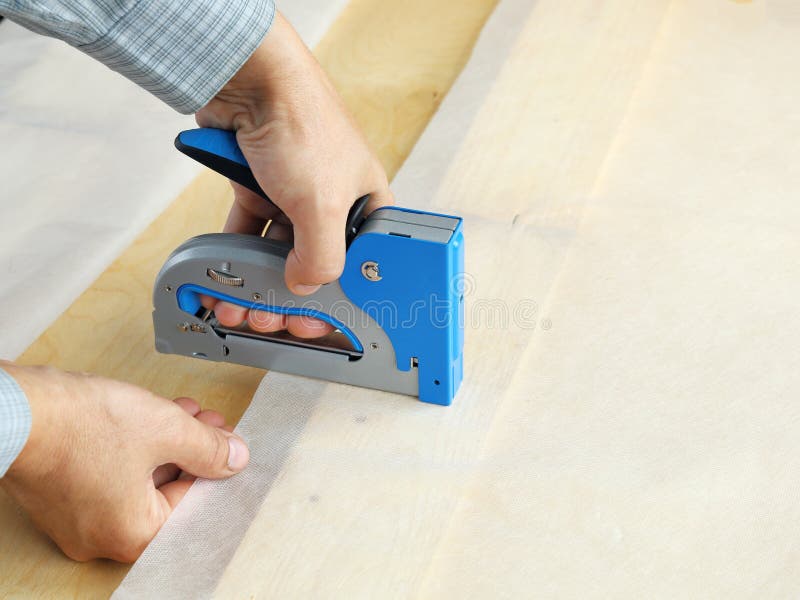 Construction Stapler in Hand, Connects Protective Material To the ...
