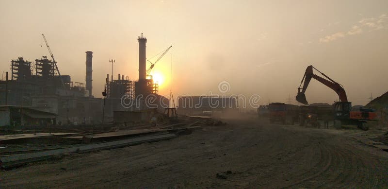 Construction of Steel-Alloy Plant in Progress while Sunset Over that ...