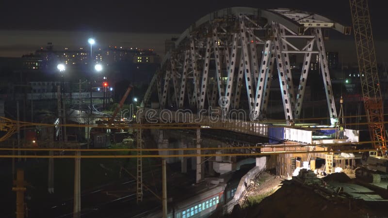 The Construction of a Steel Bridge and Night Movement of Trains on a ...
