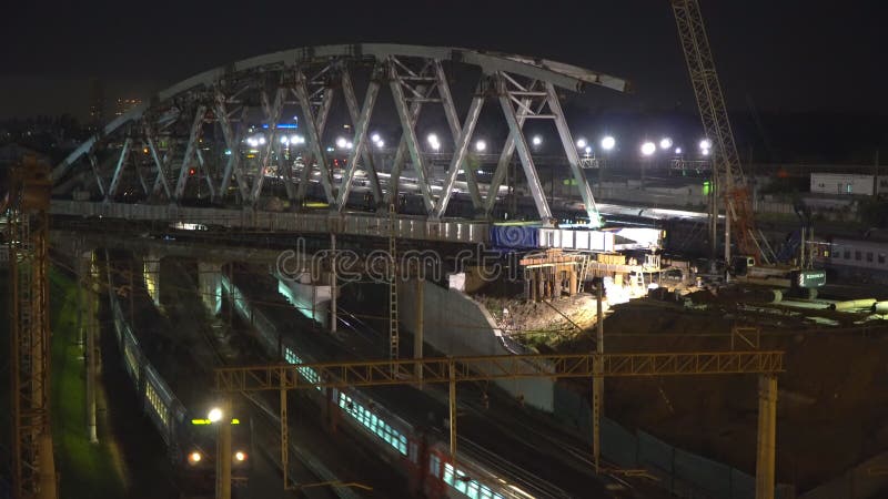 The Construction of a Steel Bridge and Night Movement of Trains on a ...