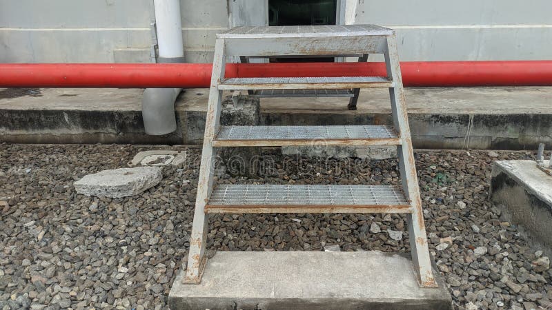 Construction of a Steel Ladder that Goes through a Large Pipe Stock ...