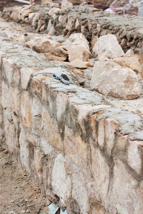 Construction of a Stone Wall Stock Image - Image of building, wall ...