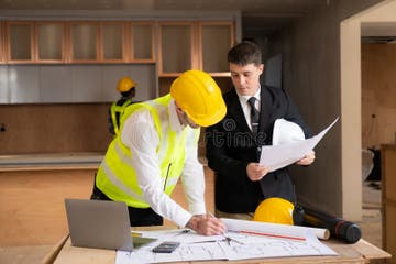 Engineers Reading Blueprints Stock Photos - Free & Royalty-Free Stock ...