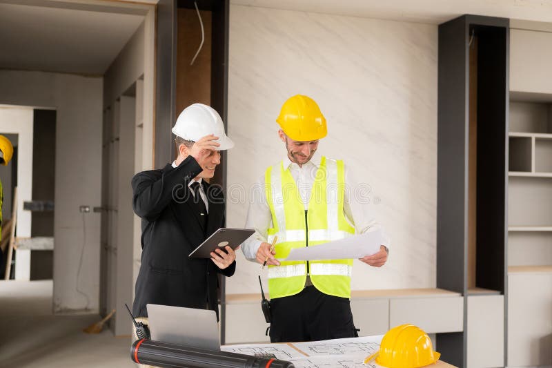 Construction and Structural Concept Engineers Working on Drawings at ...