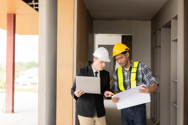 Construction and Structural Concept Engineers Working on Drawings at Blueprints Meeting Stock ...