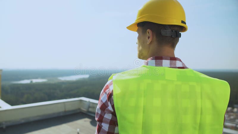 Construction Supervisor Checking Building Standing Roof, Professional ...