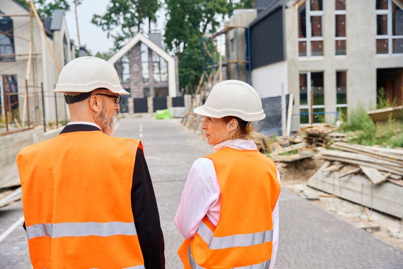 Construction Supervisor Communicating with Foreman during Site ...