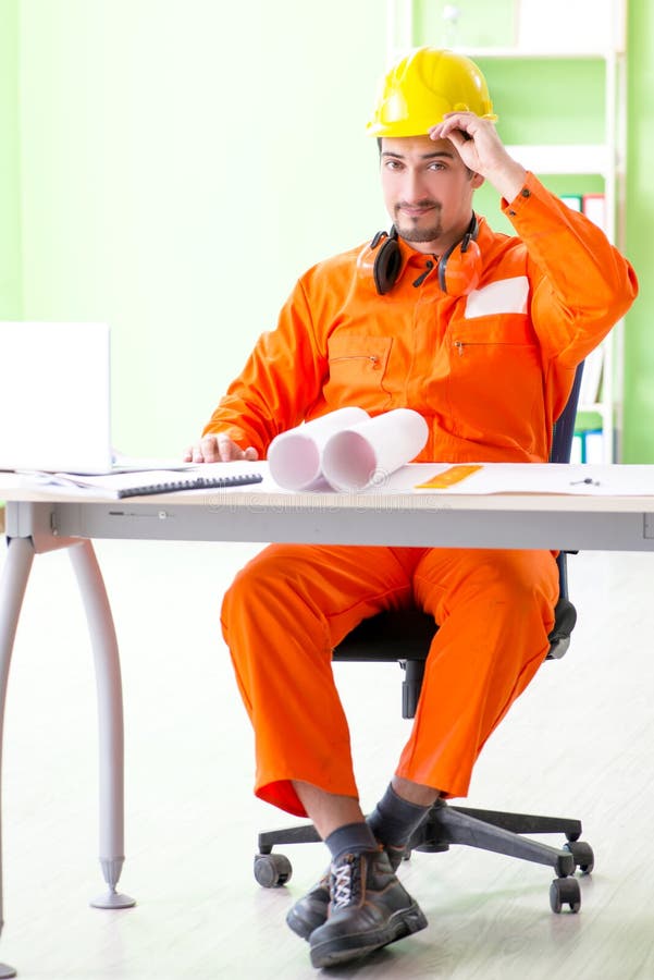 The Construction Supervisor Planning New Project in Office Stock Photo ...