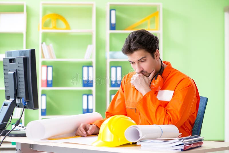The Construction Supervisor Planning New Project in Office Stock Image ...