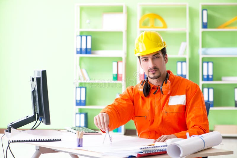 The Construction Supervisor Planning New Project in Office Stock Image ...