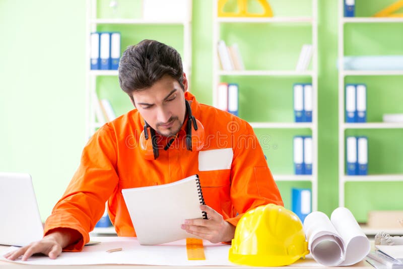 The Construction Supervisor Planning New Project in Office Stock Photo ...