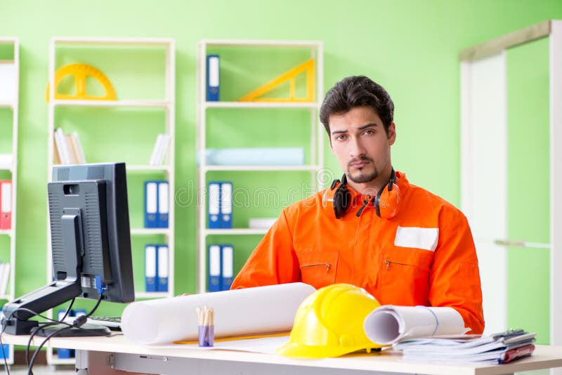 The Construction Supervisor Planning New Project in Office Stock Image ...