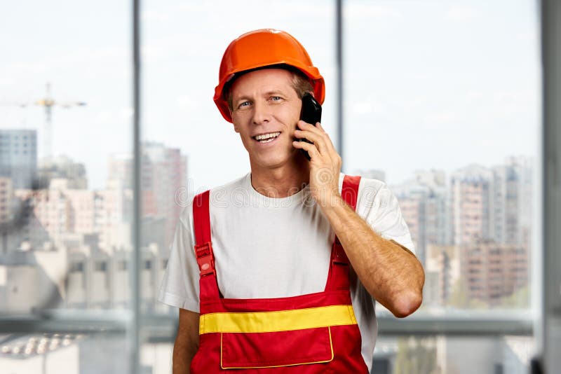 Construction Supervisor Talking On Cell Phone. Stock Image - Image of ...