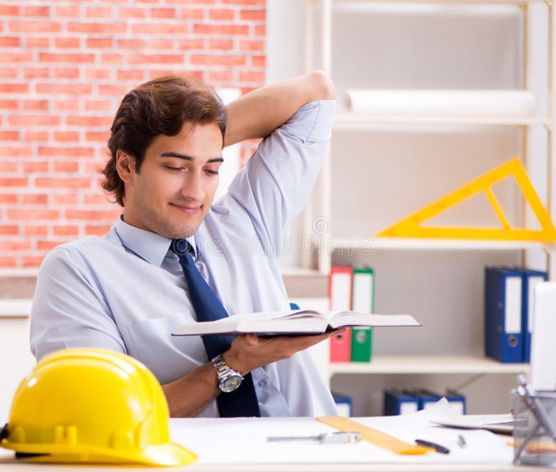 Construction Supervisor Working on Blueprints Stock Photo - Image of ...
