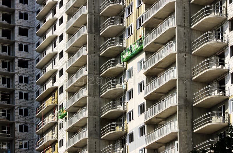 Construction Suspended Cradle with Workers on a Newly Built High-rise ...