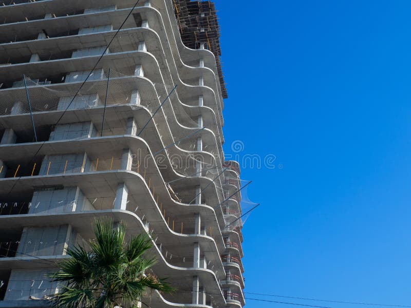 The Frame of a High-rise Building Under Construction. Reinforced ...