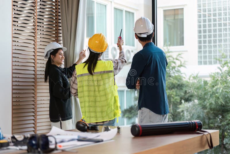 Construction Team Collaborating on Project Planning in a Modern ...