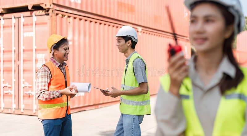 Construction Team Engaging in Discussion with Blueprints and ...