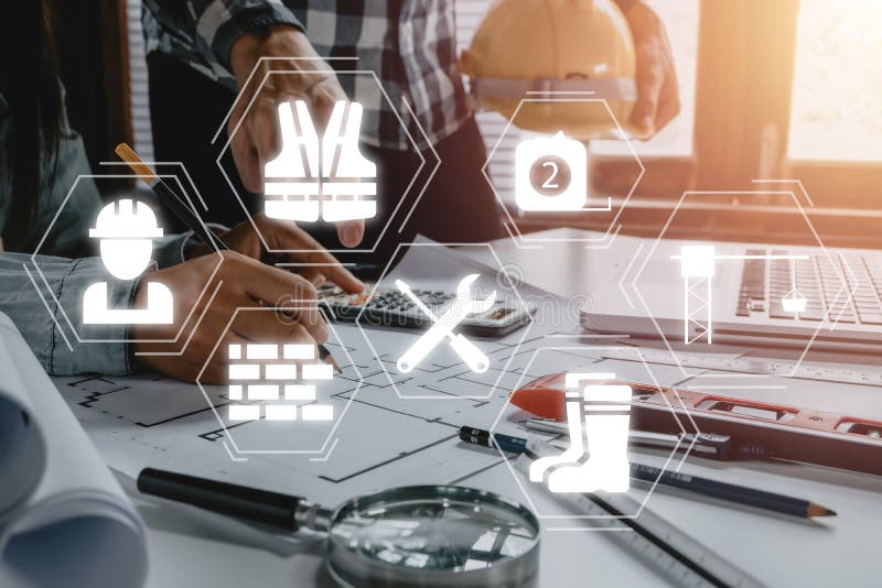 Engineering Man Working on Desk with Building Information Modeling Icon ...