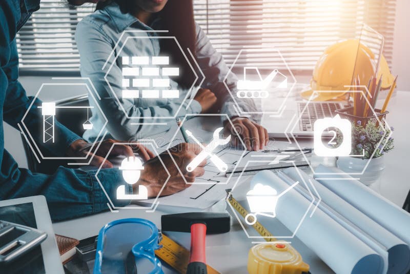 Engineering Man Working on Desk with Building Information Modeling Icon ...