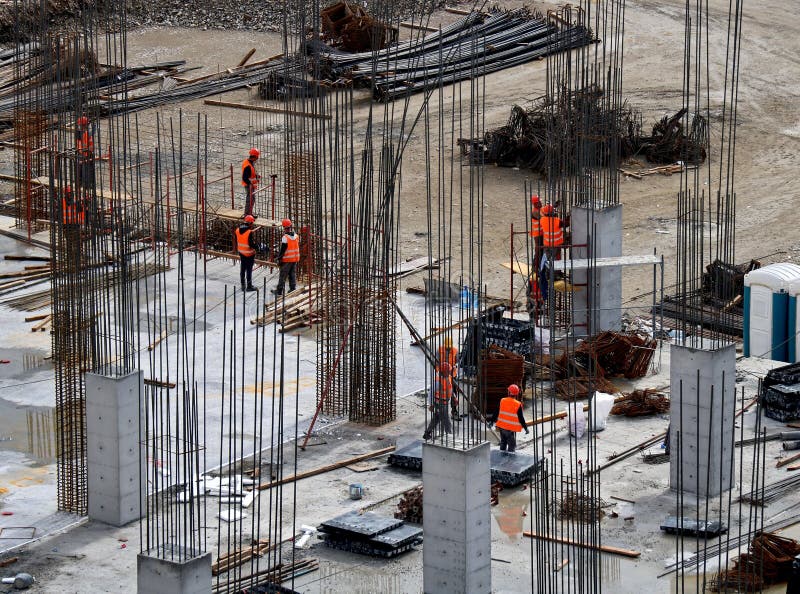 Laborers Working on Modern Construction Site Editorial Photo - Image of ...