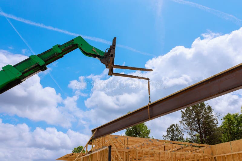 Construction Telehandler Crane Lifts Steel Beam at Building Site Stock ...