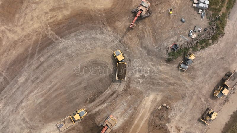 Construction Tipper Trucks Being Loaded Up with Earth by a Digger Stock ...
