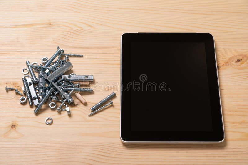 Construction Tool and a Digital Tablet Lie on a Light Wooden Table ...