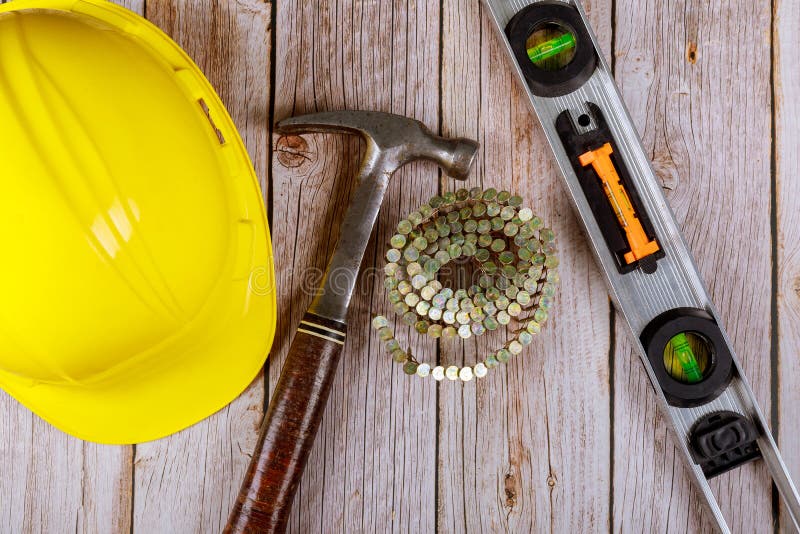 Construction Tools with Hammer, Nails and Level on Builder in Helmet ...