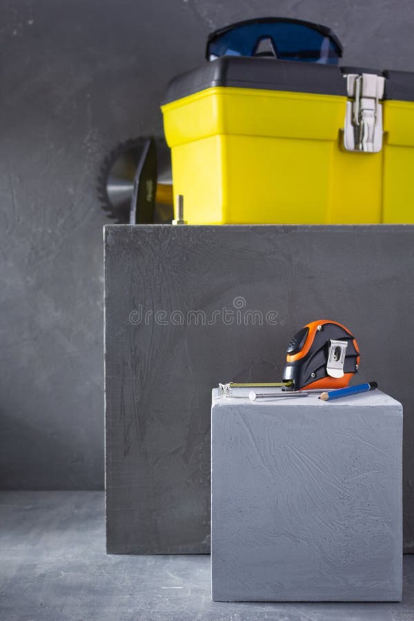 Construction Tools at Concrete Cube or Blocks Near Wall Background ...