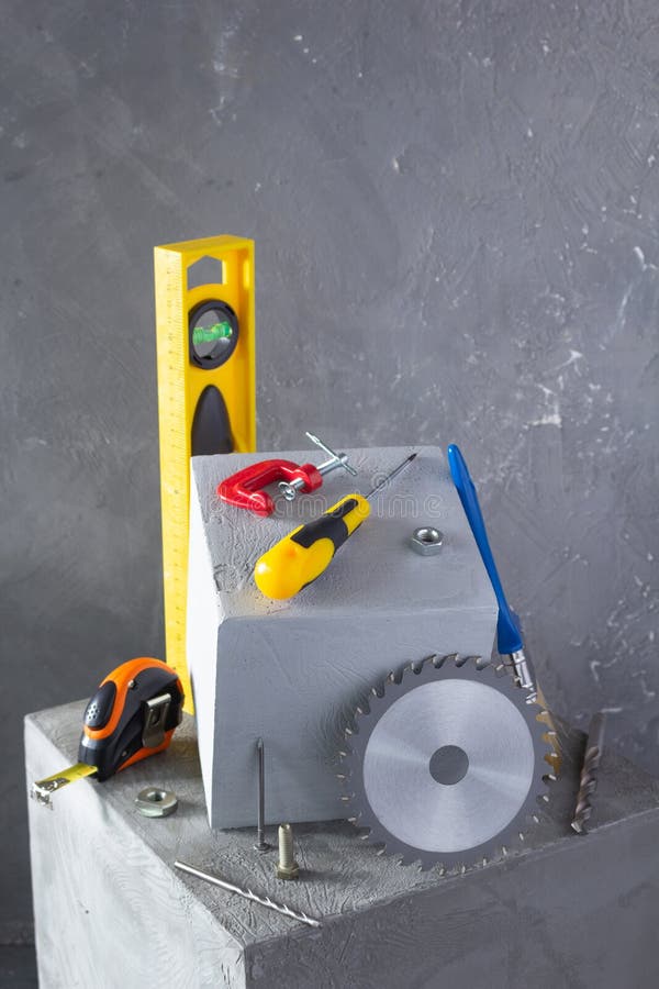 Construction Tools at Concrete Cube or Blocks Near Wall Background ...