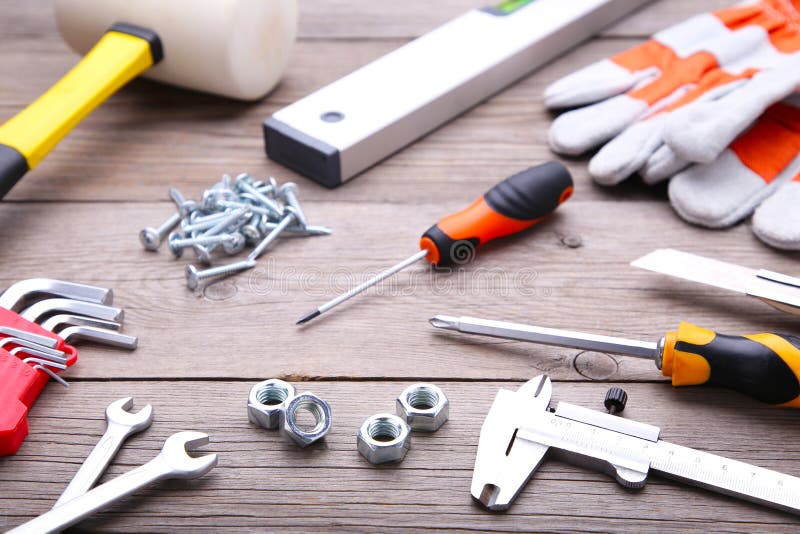 Construction Tools on a Grey Wooden Desk Stock Photo - Image of ...