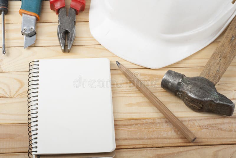 Construction Concept. Work Tools, White Helmet, Notepad and Pencil on ...