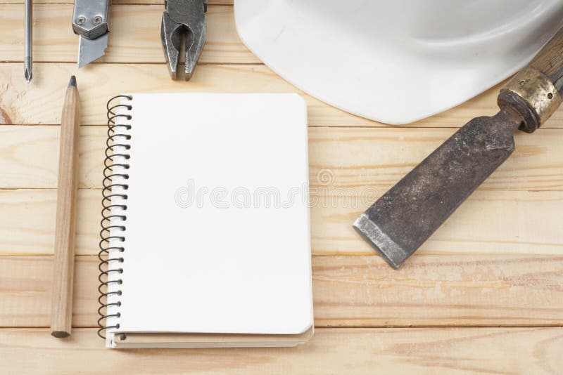 Construction Concept.Work Tools, White Helmet, Notepad and Pencil on ...