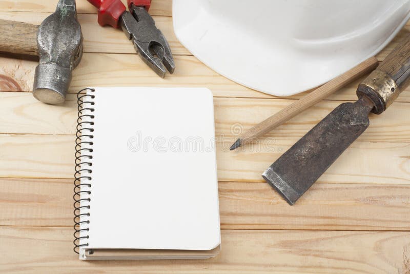Construction Concept.Work Tools, White Helmet, Notepad and Pencil on ...