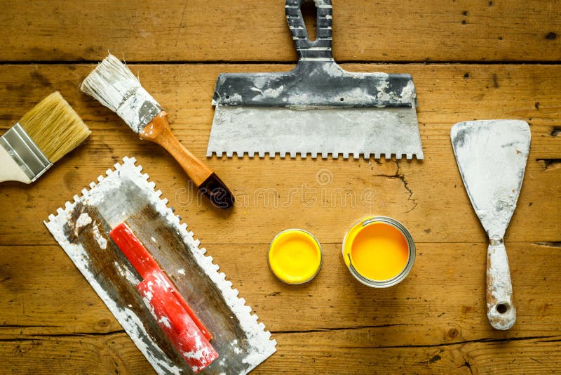 Construction Tools on a Wooden Table with Yellow Paint Stock Photo ...