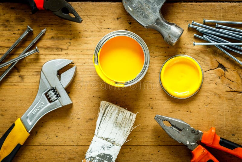 Construction Tools on a Wooden Table with Yellow Paint Stock Image ...