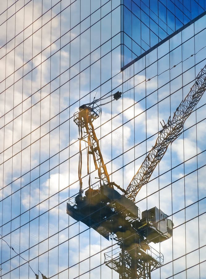 Construction Tower Cane Reflected on the Glass Office Building. Stock ...