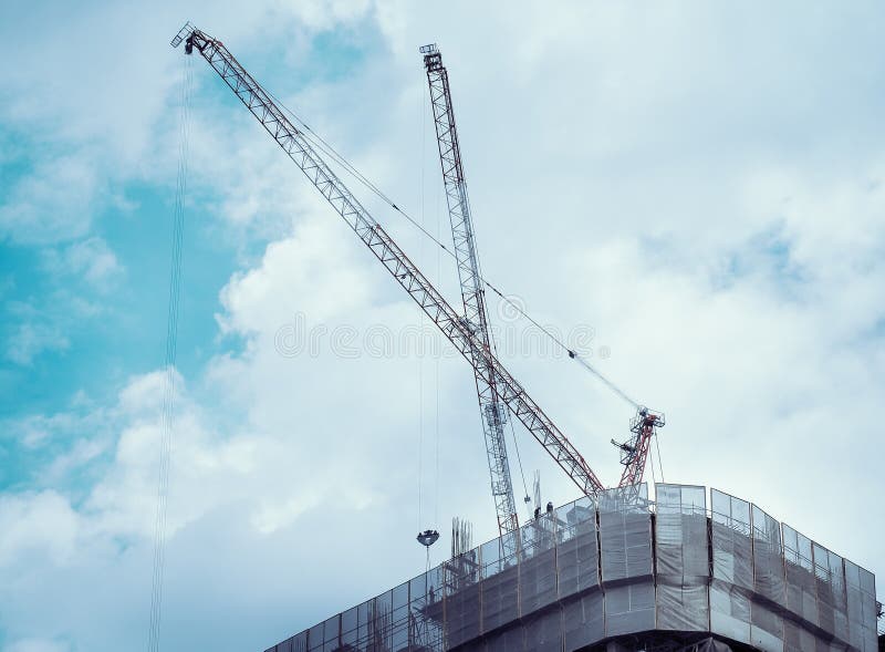 Construction Tower Canes Over Construction Site. Stock Image - Image of ...