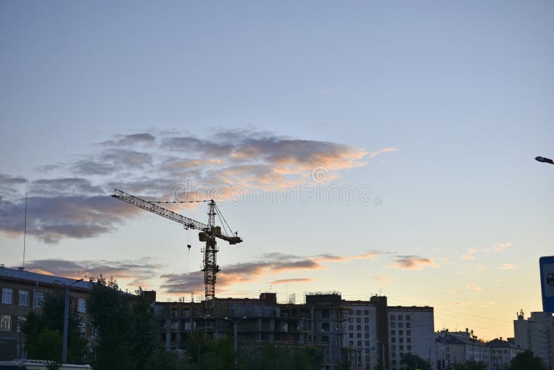 Construction Tower Crane in the City at Sunset Stock Image - Image of ...