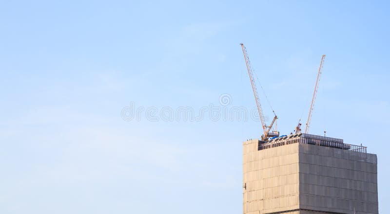 Construction Tower Cranes Building on Empty Blue Sky Background ...